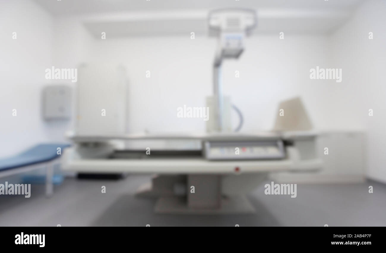 X-ray room with new machine and couch in blurred motion Stock Photo - Alamy