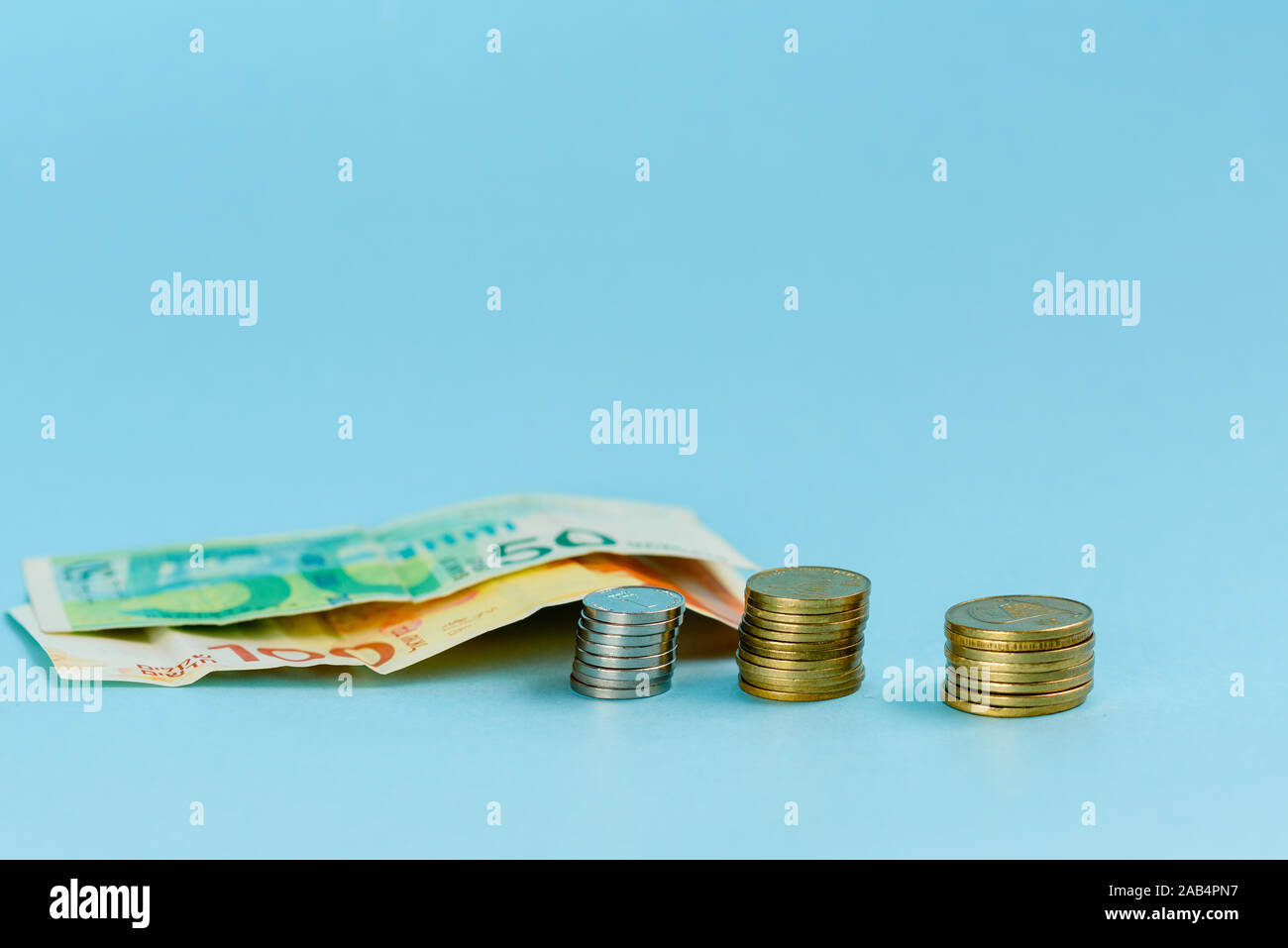 Israeli money of new Israel 50 and 100 shekel and stack of 50 agorot ...