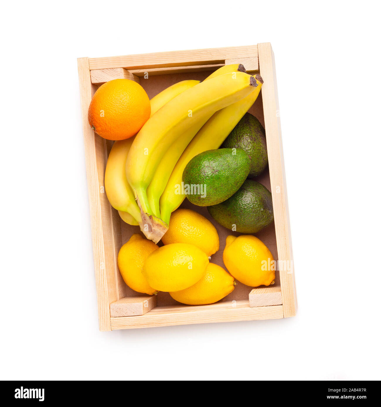 Fresh and eco fruits inside wooden box isolated on white Stock Photo ...
