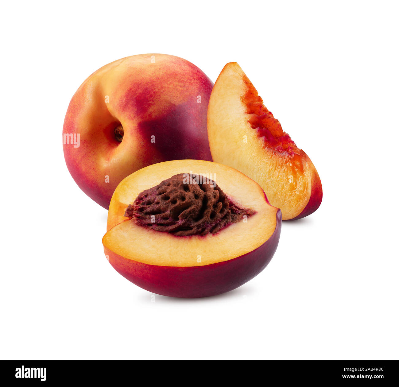 Smooth-skinned whole nectarine, one half with kernel and one unpitted ...