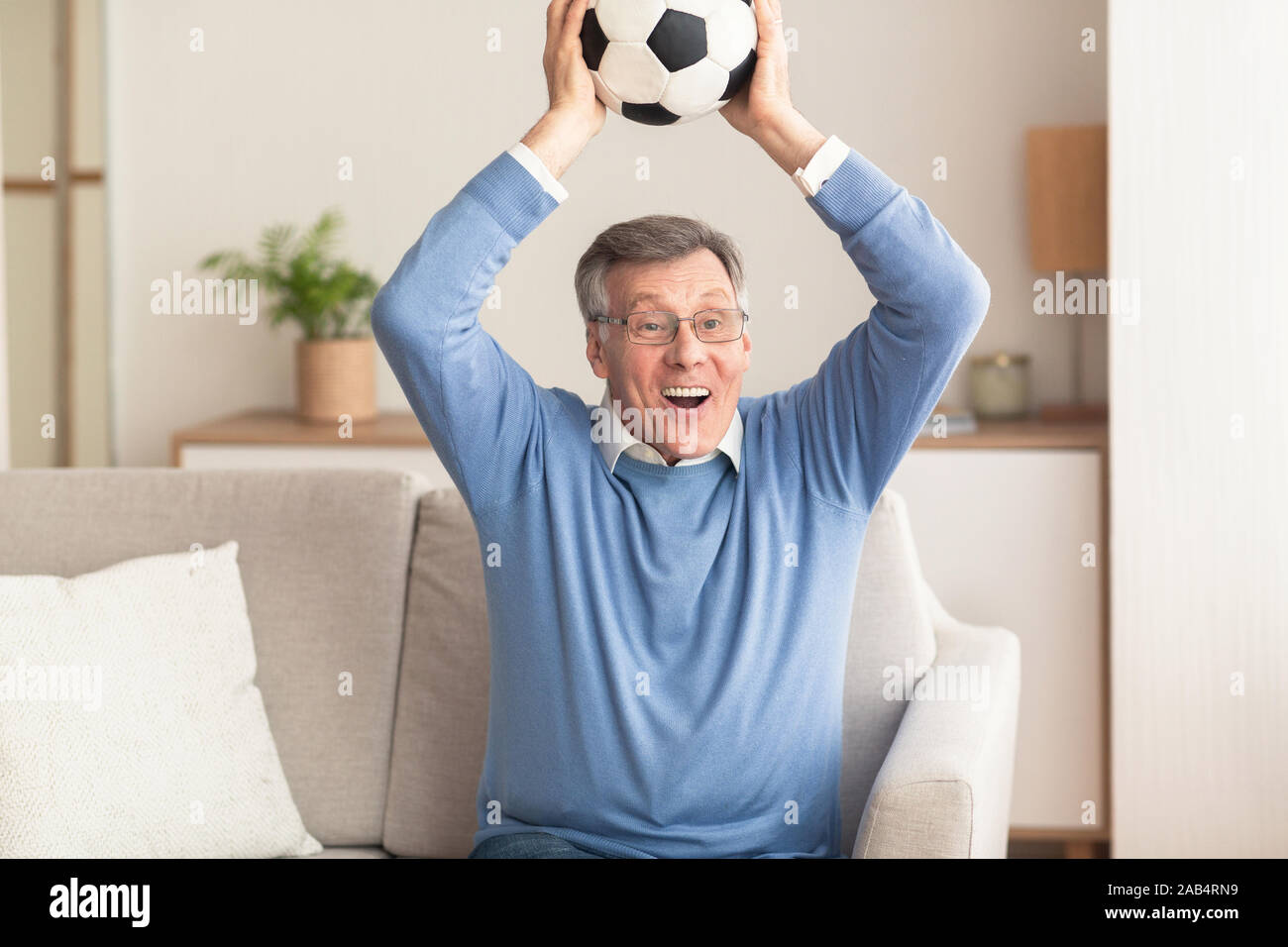 Old man watching football match hi-res stock photography and images - Alamy