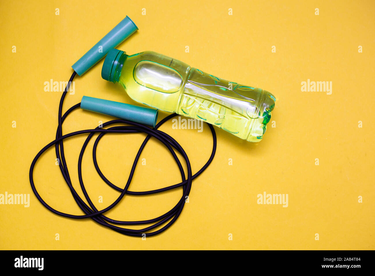 Sport flat lay concept with copy space. Rope with water representing a ...