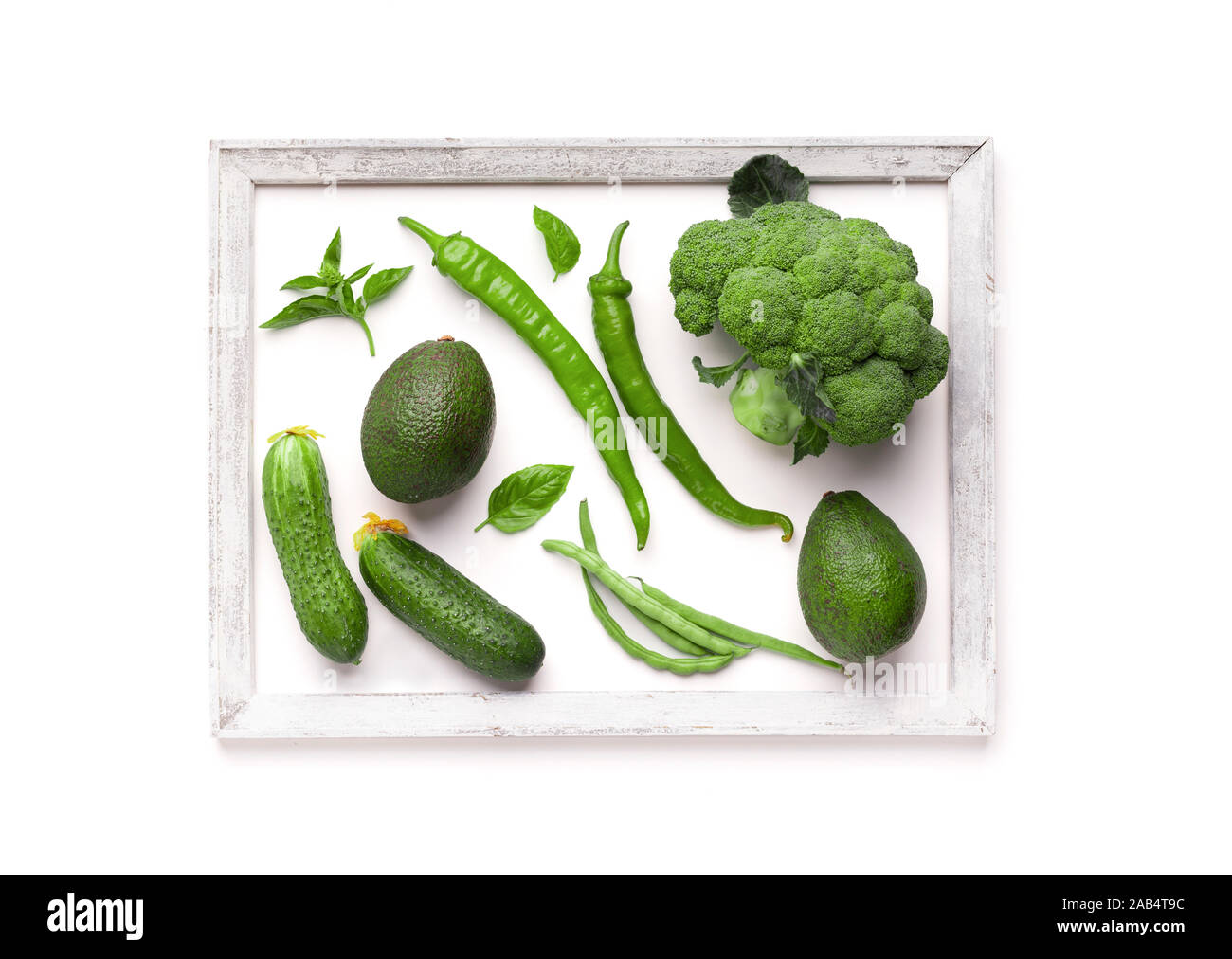 Creative picture of green vegetables inside wooden frame Stock Photo ...