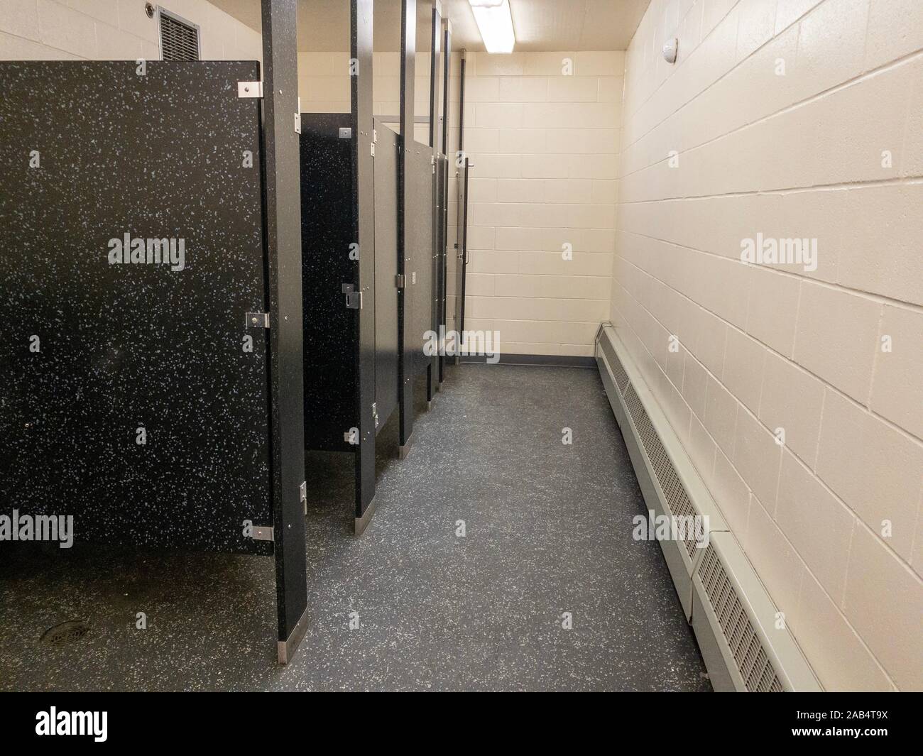 Interior of a public ablution block with individual cubicles opening to ...