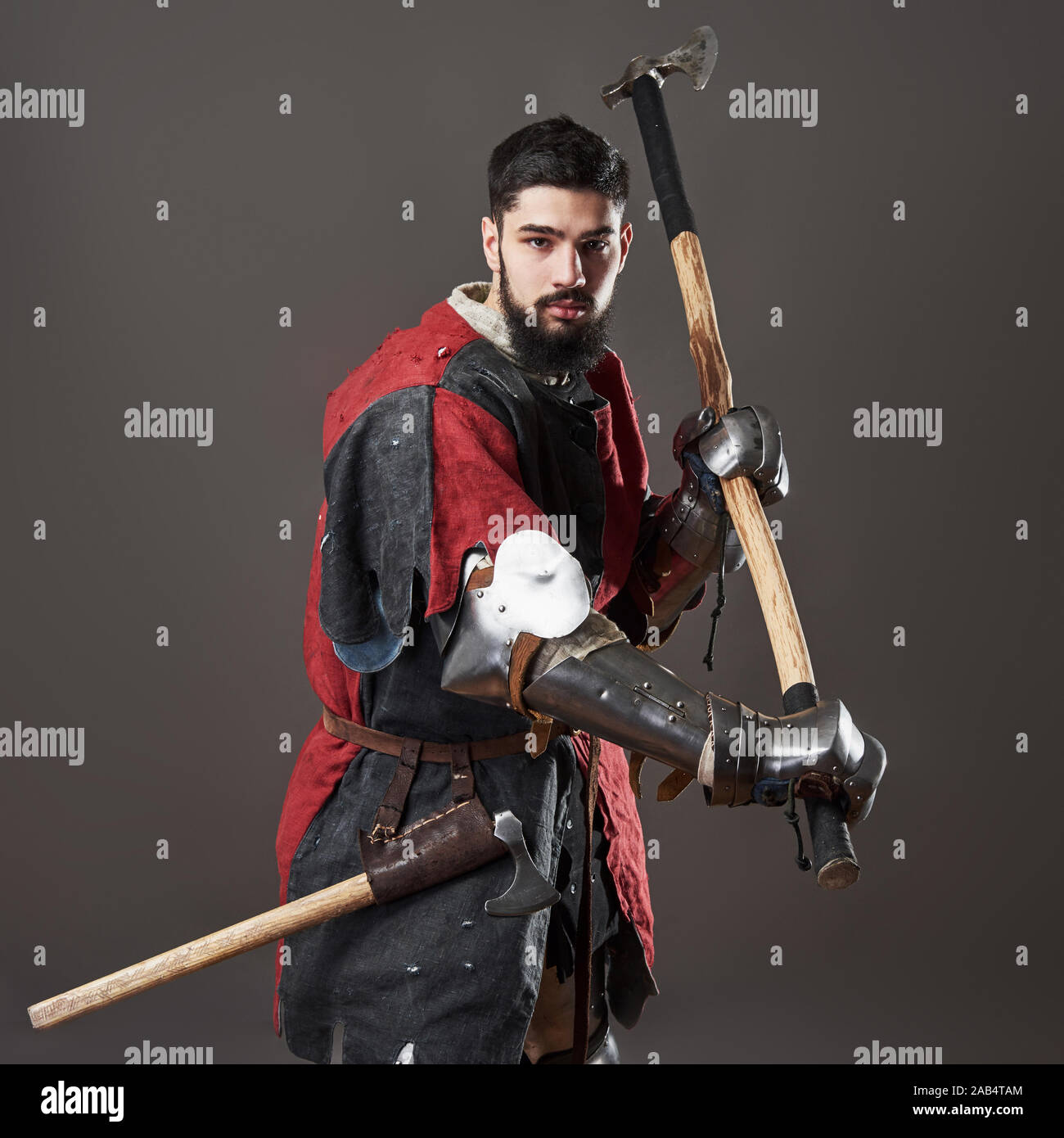 Medieval knight on grey background. Portrait of brutal dirty face ...