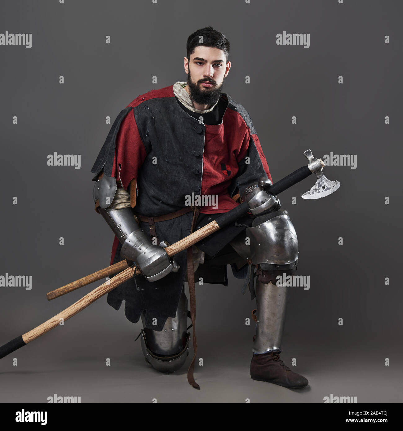 Medieval knight on grey background. Portrait of brutal dirty face ...