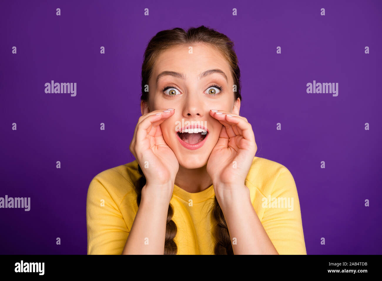 Closeup photo of amazing lady long braids holding arms near mouth ...