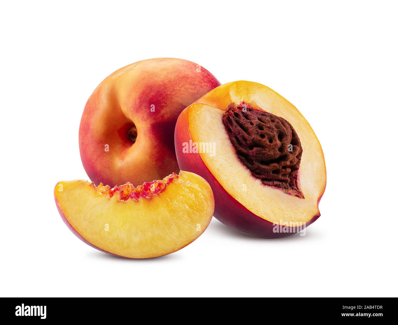 Smooth-skinned whole nectarine, one half with kernel and one unpitted ...