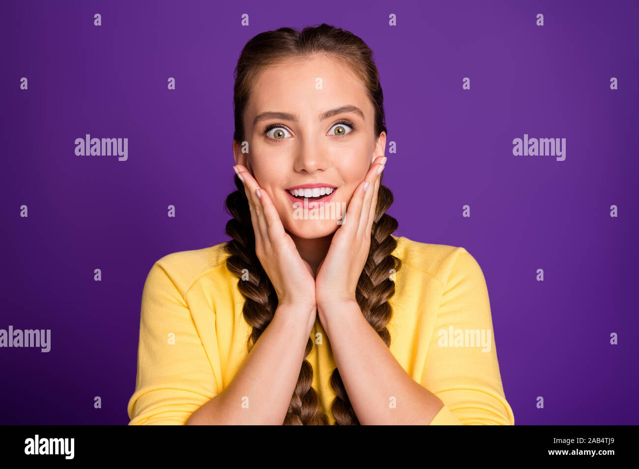 Closeup photo of amazing lady long braids holding arms on cheekbones ...
