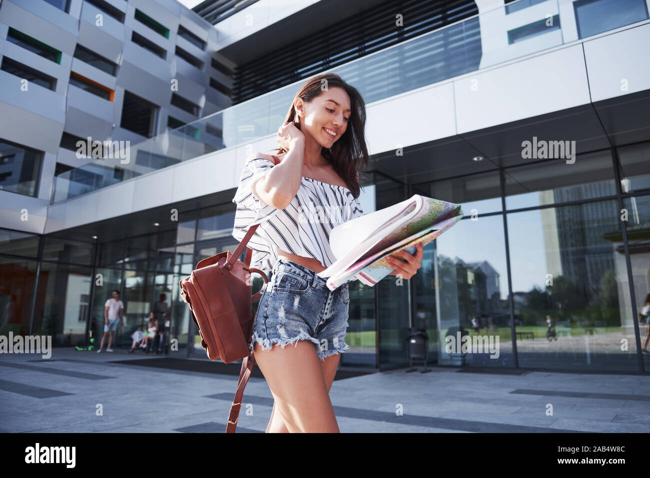 The girl is traveling with a backpack to the cities of Europe Stock ...