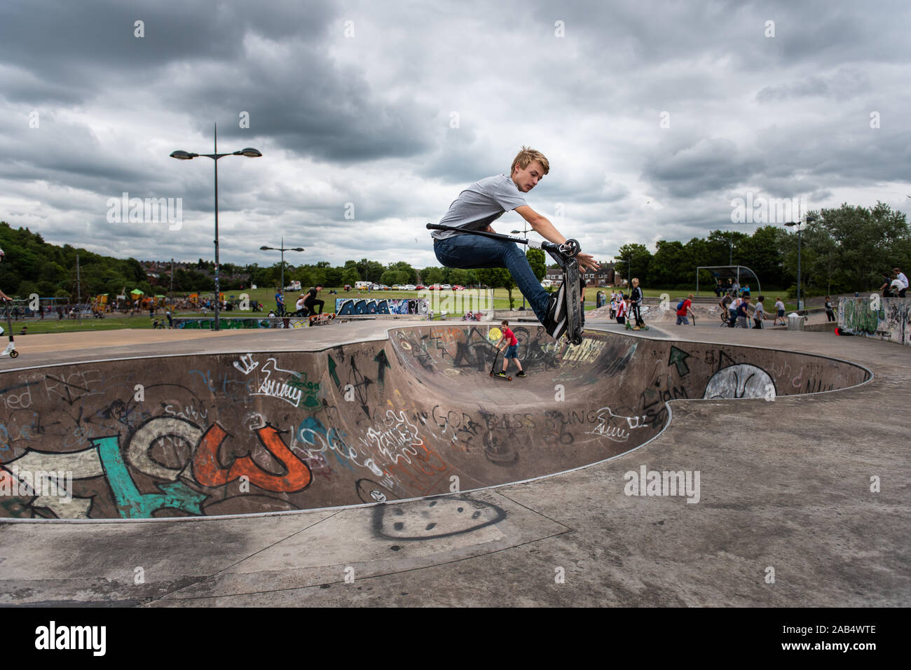 Professional scooter rider Josh Glass rides around the local skate park ...