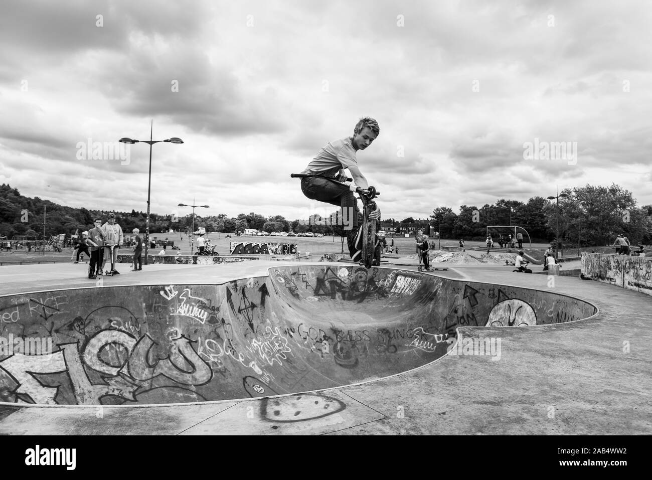 Professional scooter rider Josh Glass rides around the local skate park ...