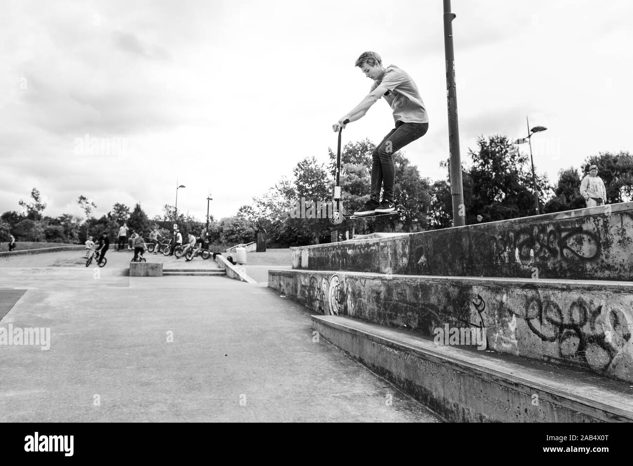 Professional scooter rider Josh Glass rides around the local skate park ...