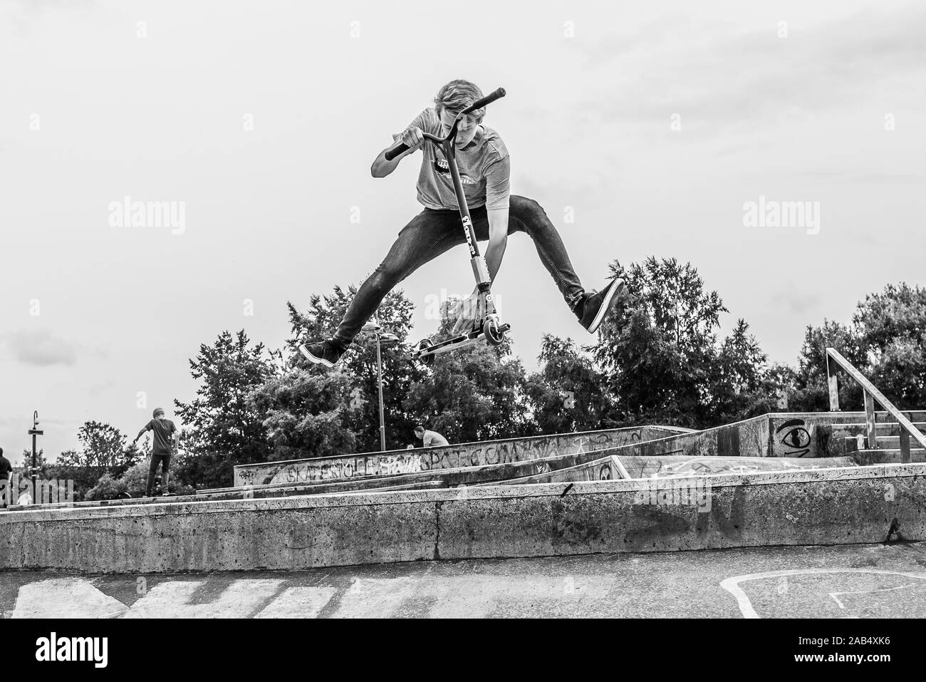 Professional scooter rider Josh Glass rides around the local skate park ...