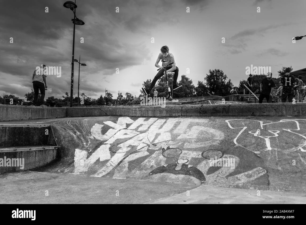 Professional scooter rider Josh Glass rides around the local skate park ...