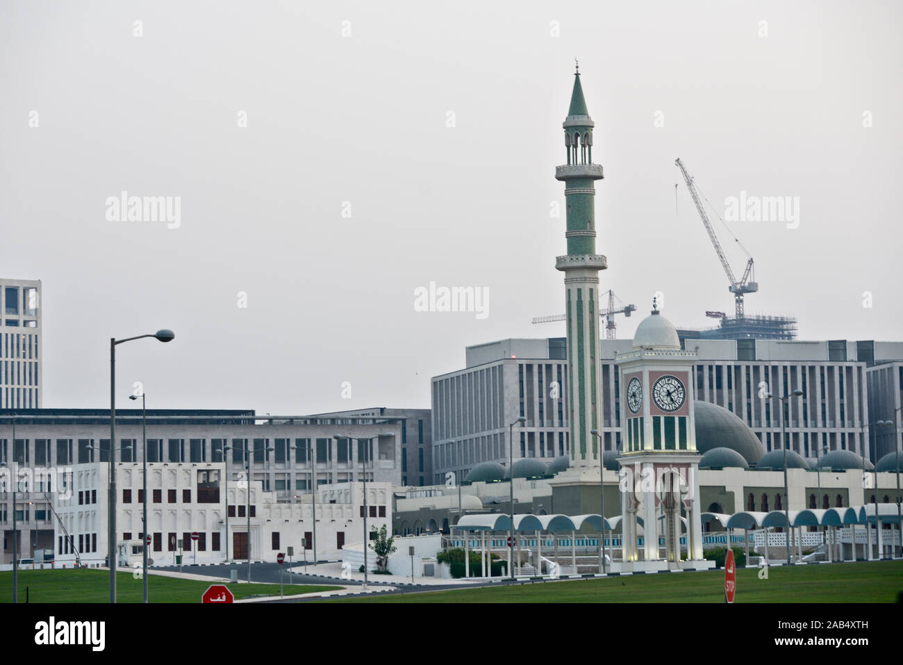 Doha: Clock tower and minaret outside the Emir's palace, Corniche ...