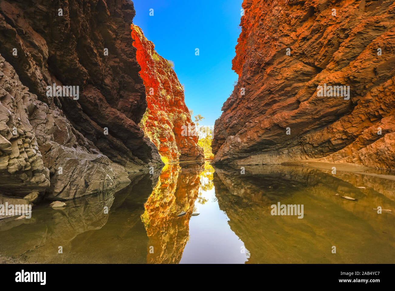 Simpsons Gap reflected in permanent waterhole in West MacDonnell ...