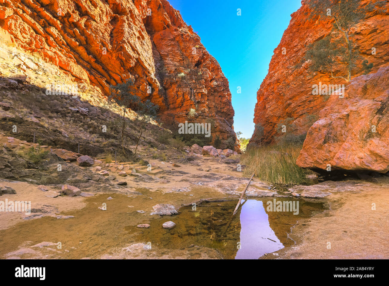 Simpsons Gap reflected in permanent waterhole in West MacDonnell ...
