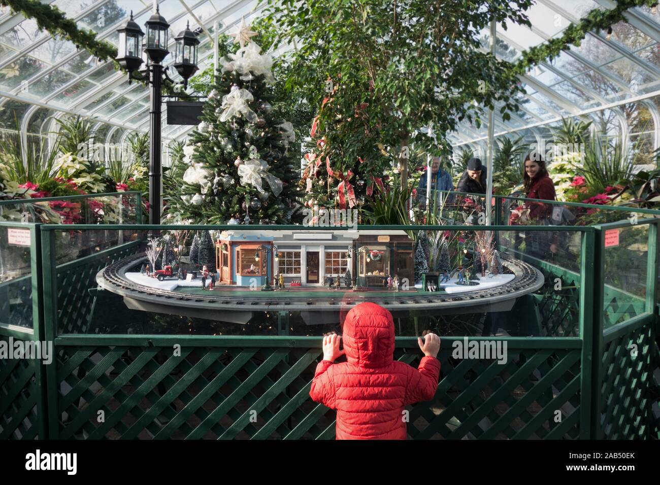 A young child looks at a Christmas display and model train at Volunteer ...