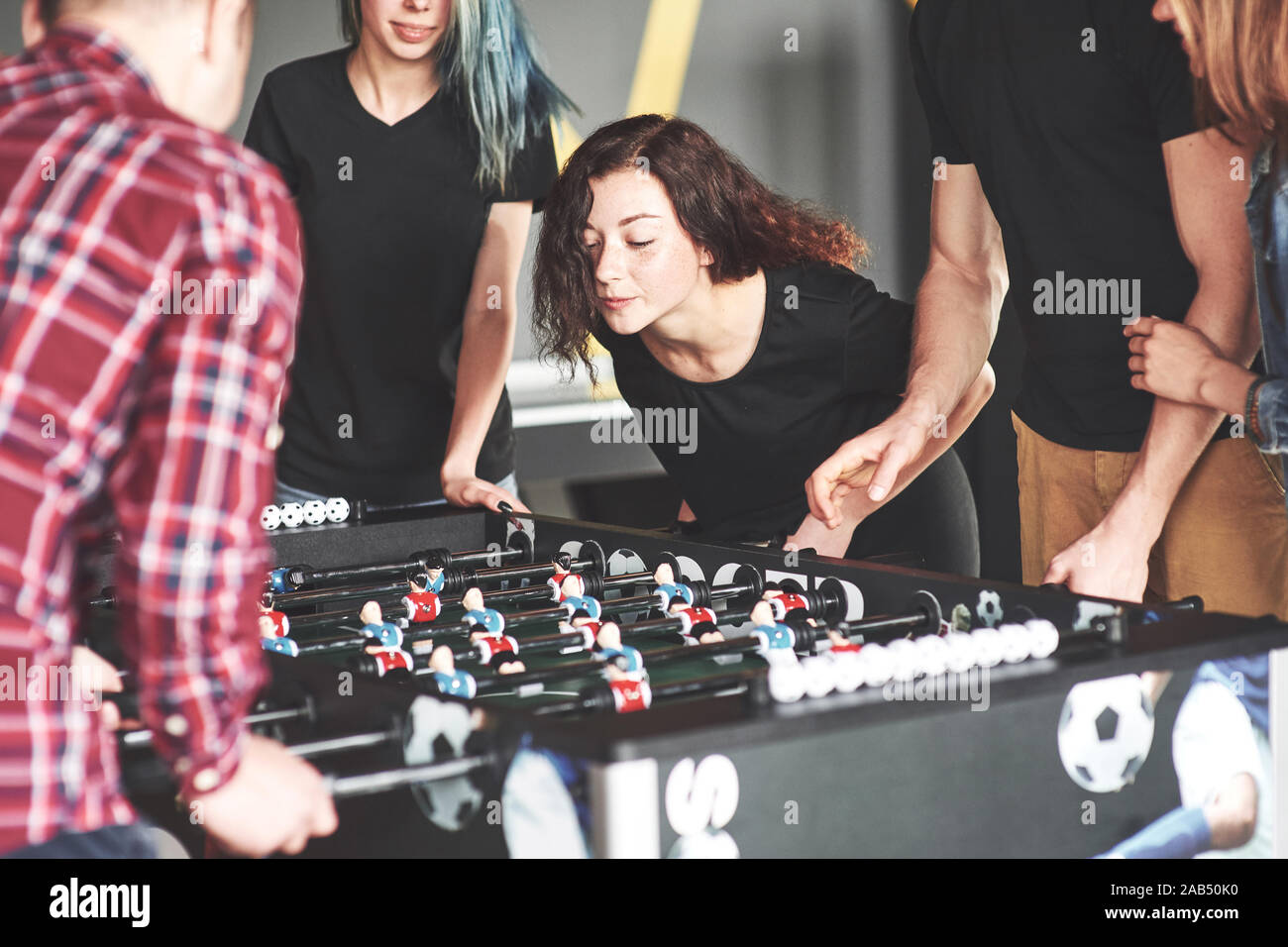 Friends together play board games, table football Stock Photo - Alamy