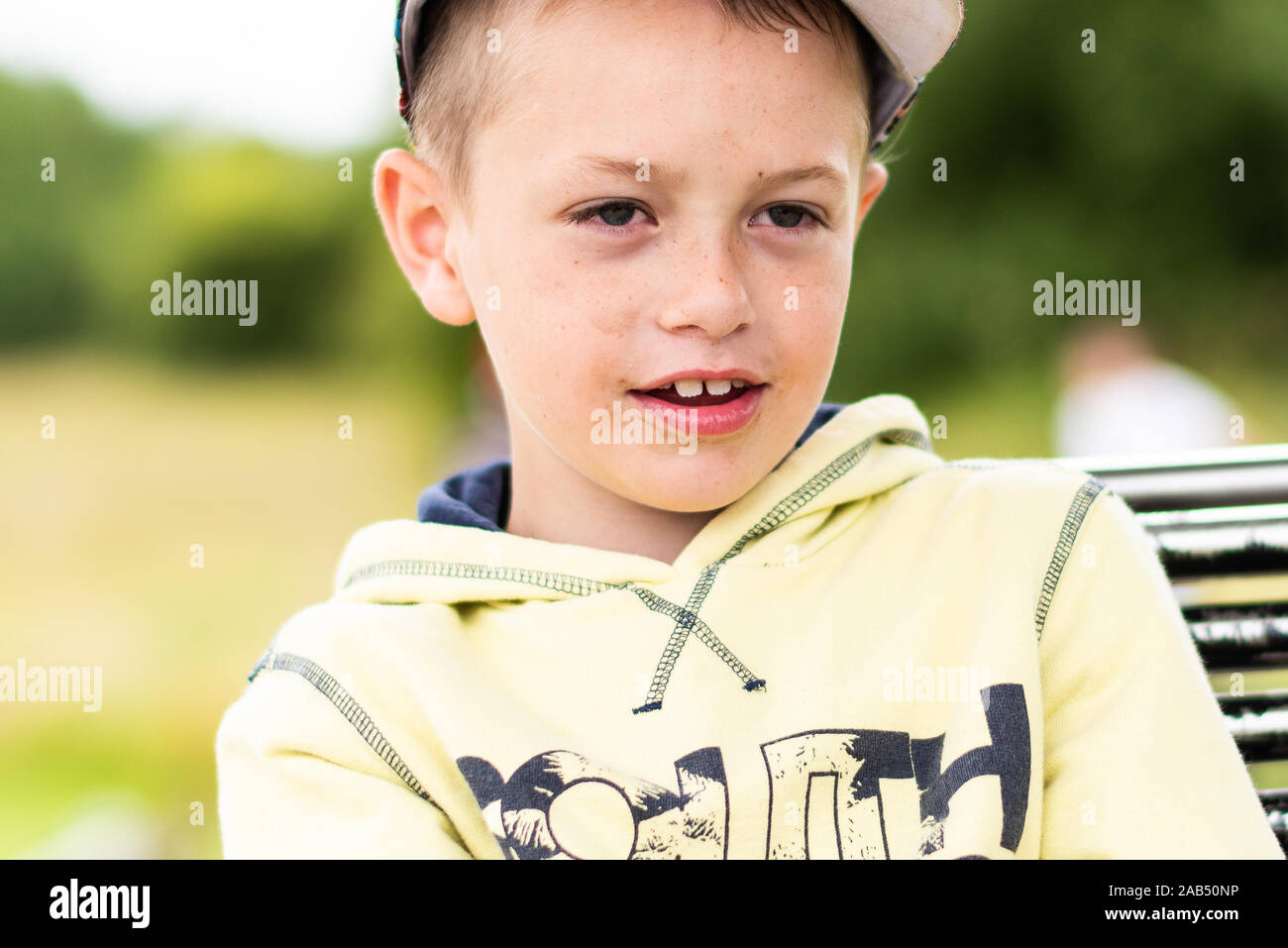 A cute little boy with ADHD, autism, Asperger syndrome riding around ...