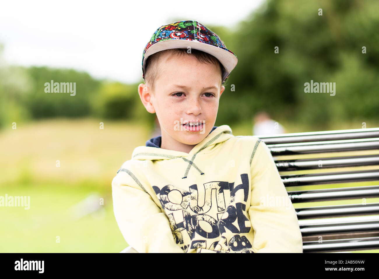 A cute little boy with ADHD, autism, Asperger syndrome riding around ...