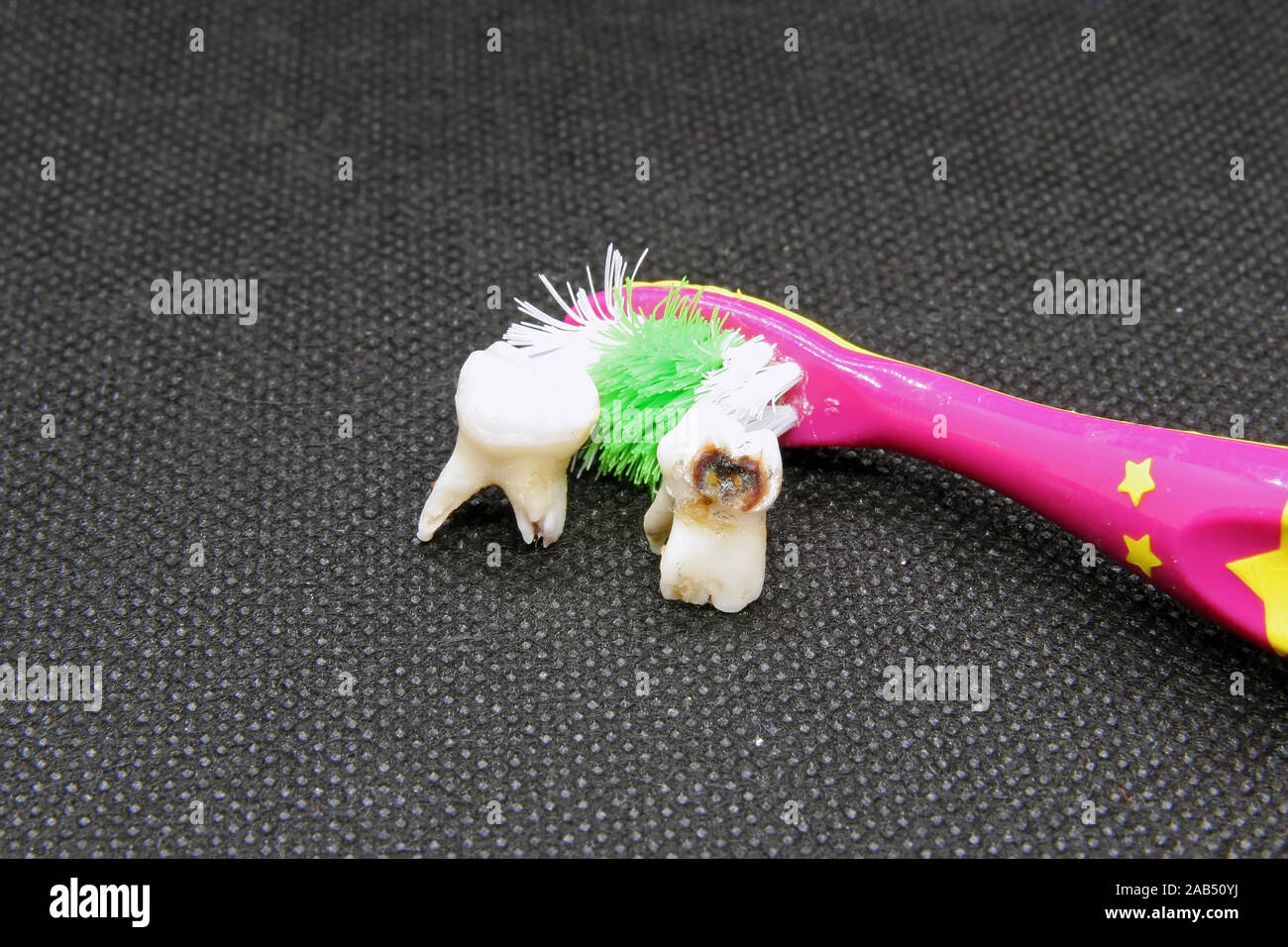 Bad tooth and toothbrush. Dental hygiene.Rotten tooth and toothbrush ...