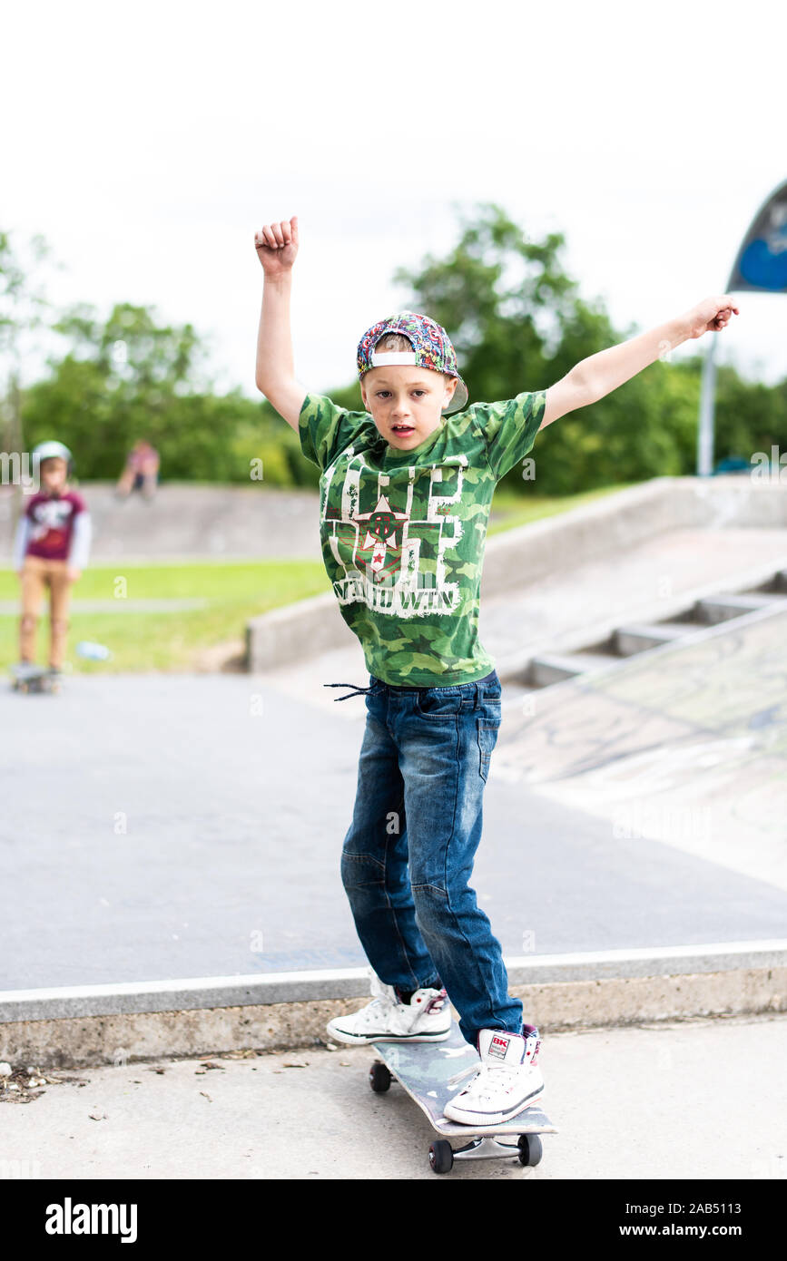 A little boy with ADHD, autism, Asperger syndrome practicing going down ...