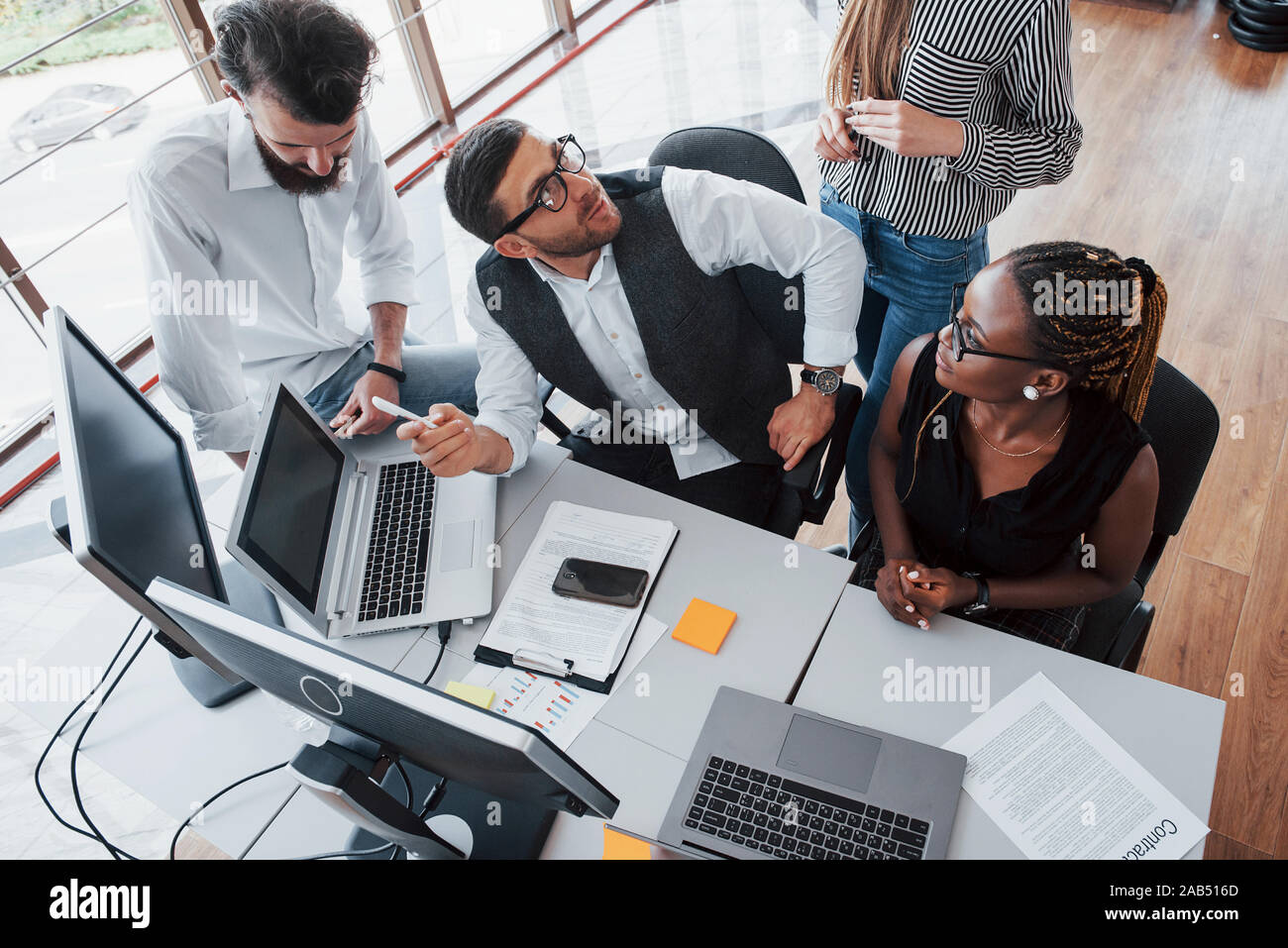 A group of multinational busy people working in the office Stock Photo ...