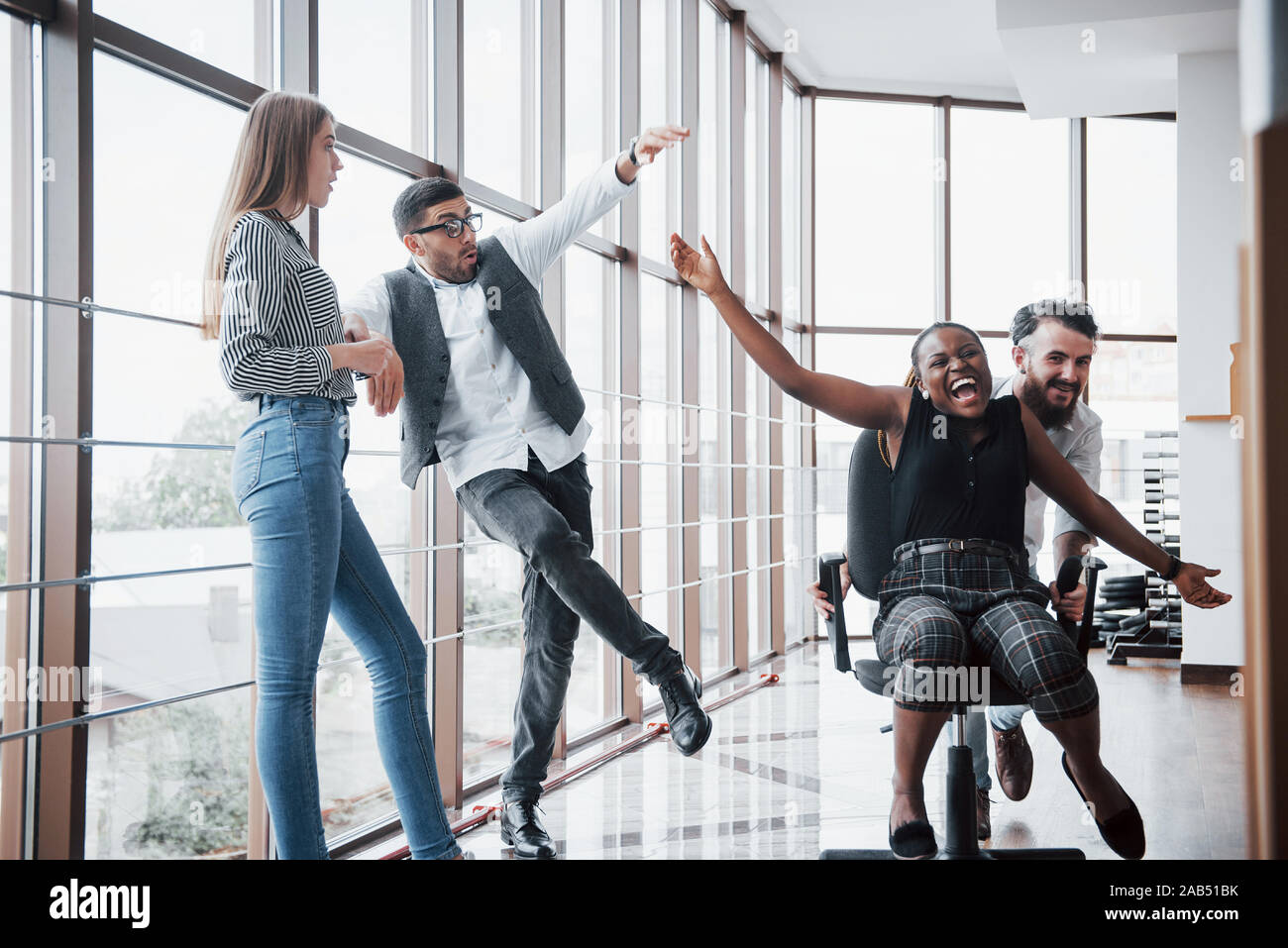 A group of business people having fun, at the office. Celebrate a ...