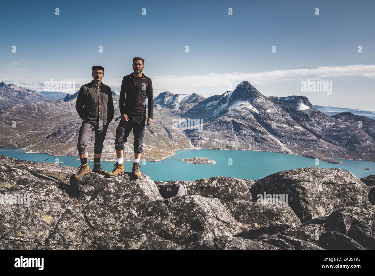 Two young man happy traveler on top of mountain in Greenland, Nuuk ...