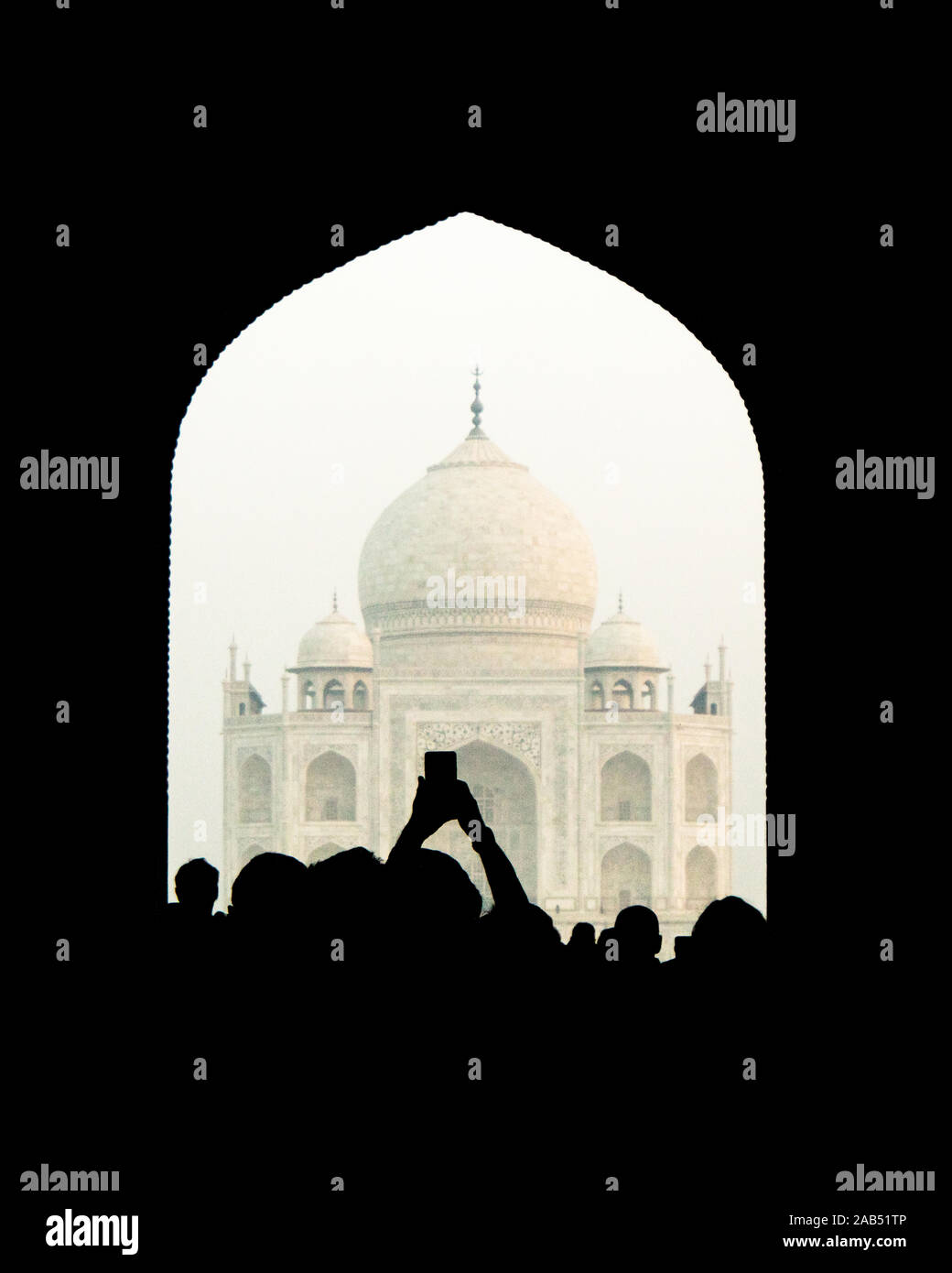 The classic angle of the Taj Mahal showing a tourist taking a photo ...