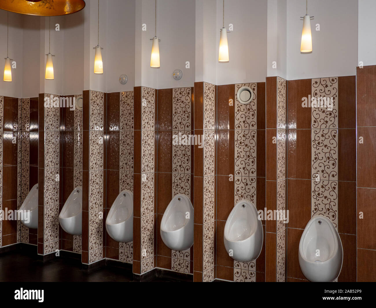 Seven urinals in a pub Stock Photo - Alamy