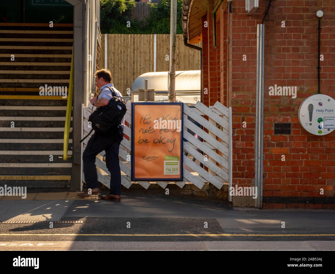 Samaritans advert on a railway station platform Stock Photo - Alamy