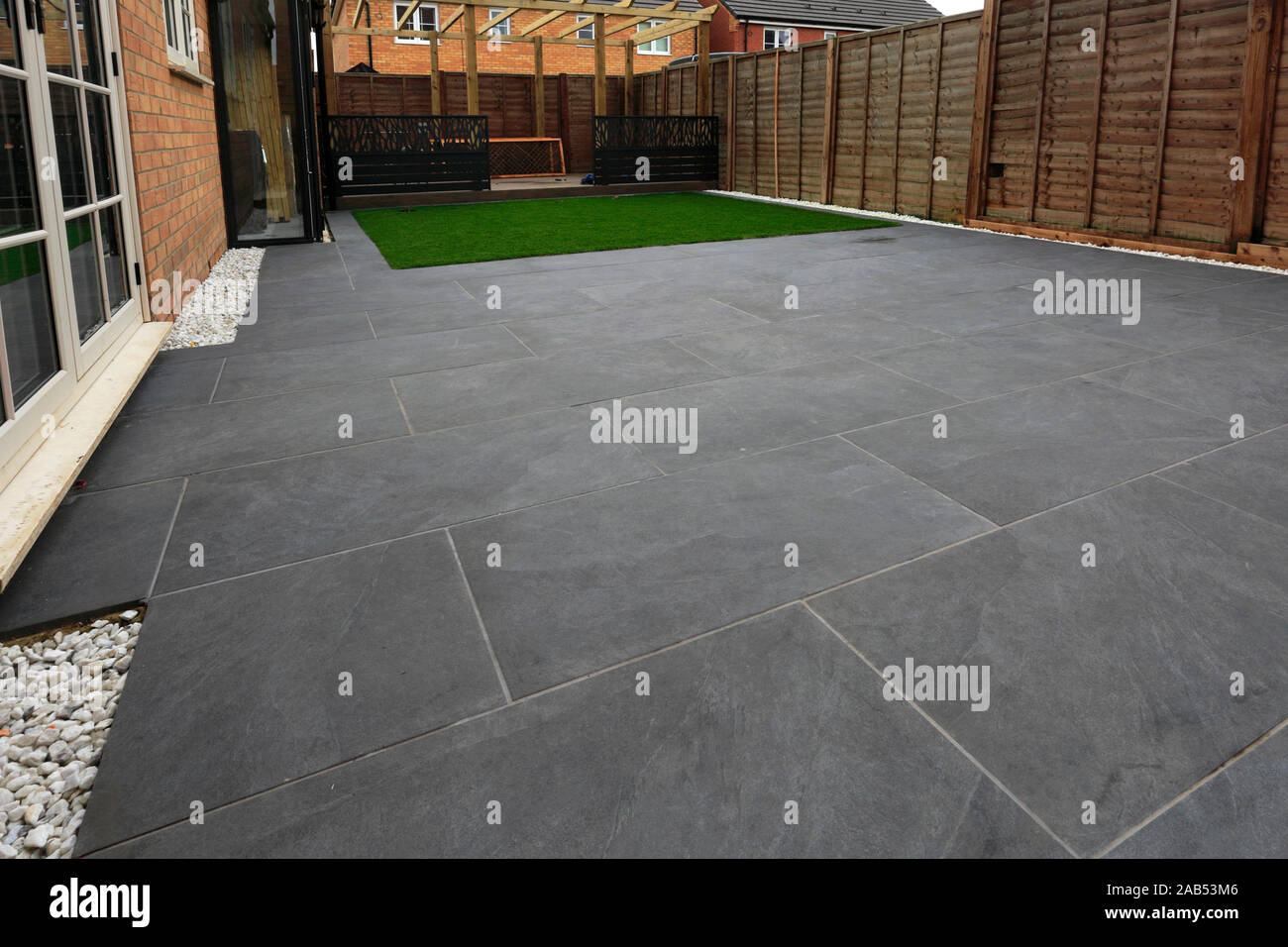 Patio paving slabs in a residential garden environment Stock Photo - Alamy