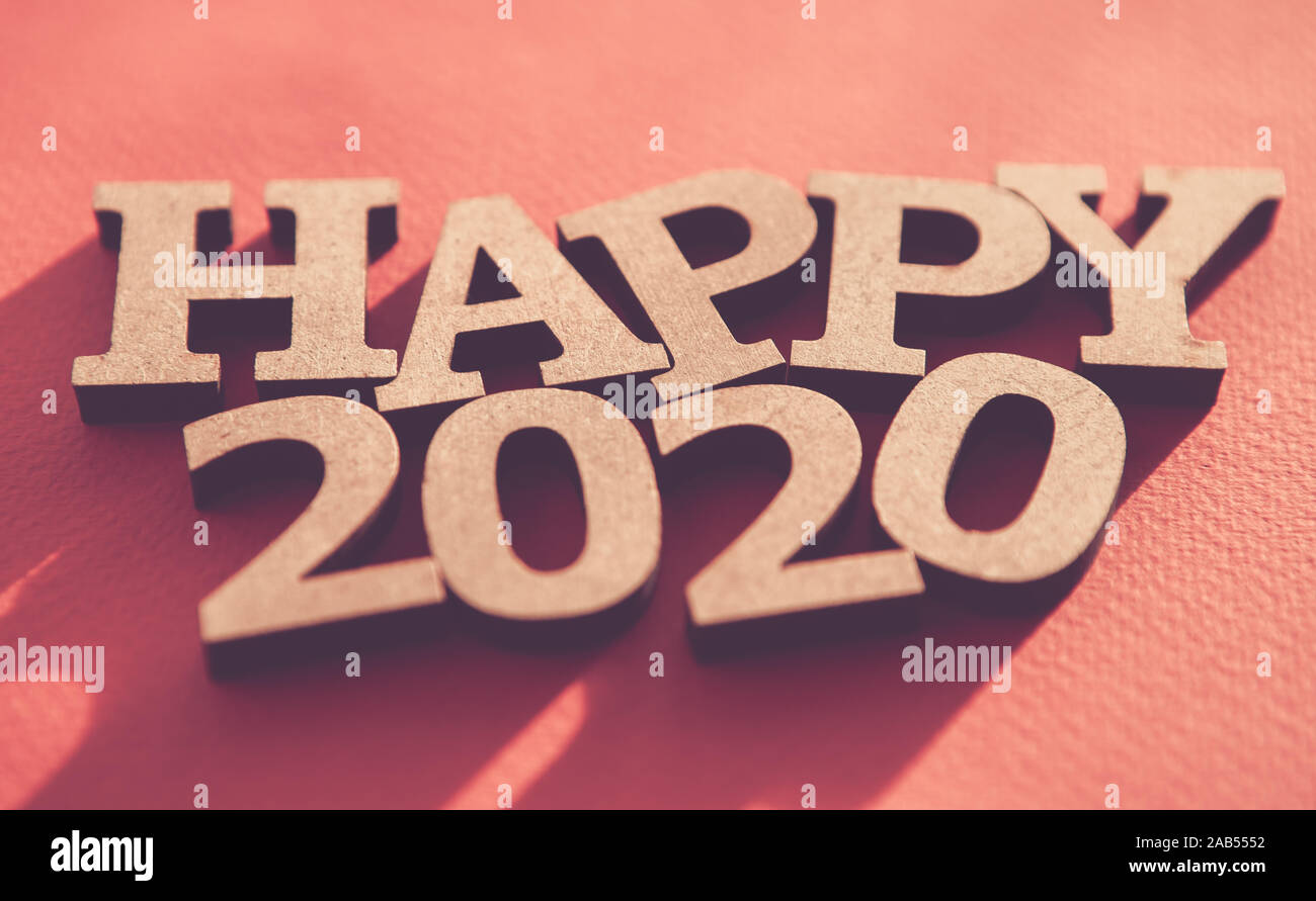 Happy 2020 background.Red wallpaper with wooden rustic style letters ...