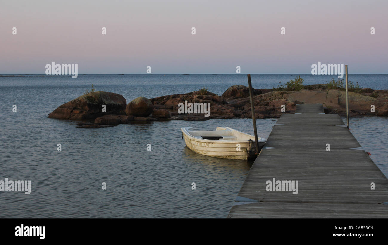 White rowing boat at the shore of Lake Vanern, Sweden Stock Photo - Alamy