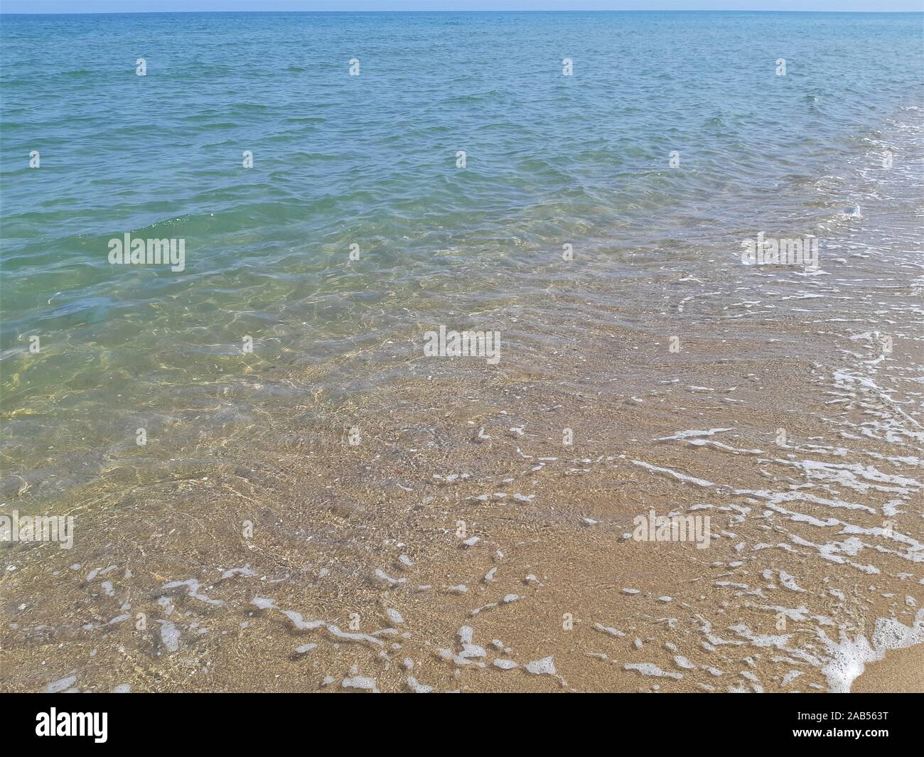Beautiful background with beach and crystal clear sea Stock Photo - Alamy