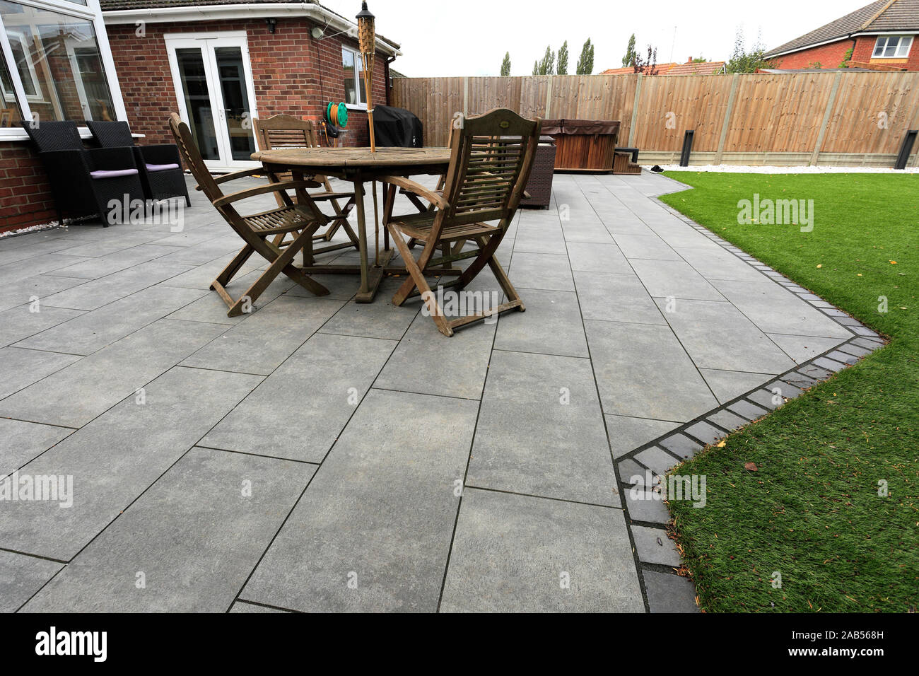Patio paving slabs in a residential garden environment Stock Photo - Alamy