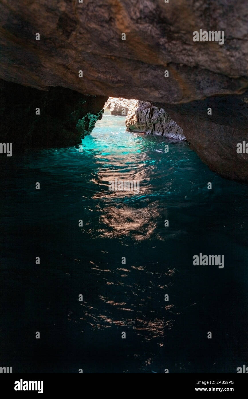 Exploring caves during boat ride around Capri Stock Photo - Alamy