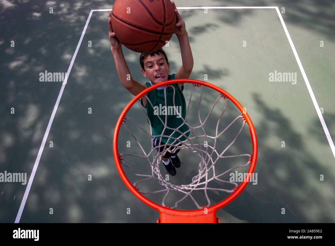 Children playing basketball overhead hi-res stock photography and ...