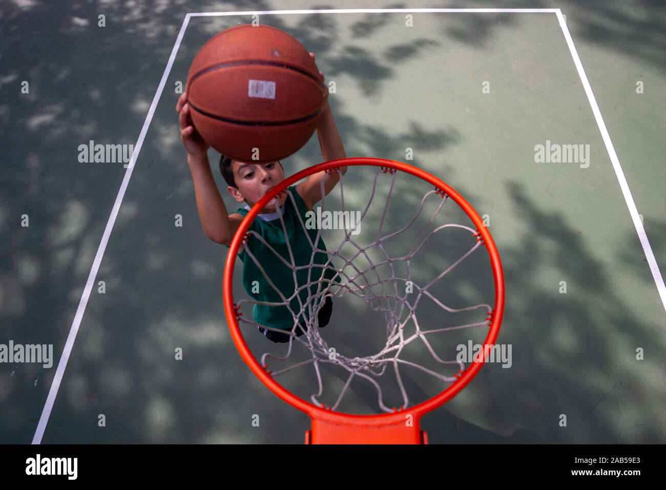 Children playing basketball overhead hi-res stock photography and ...
