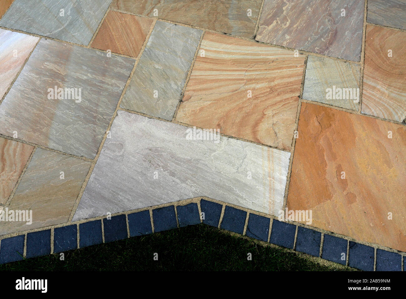 Patio paving slabs in a residential garden environment Stock Photo - Alamy