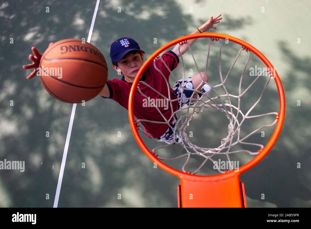 Children playing basketball overhead hi-res stock photography and ...