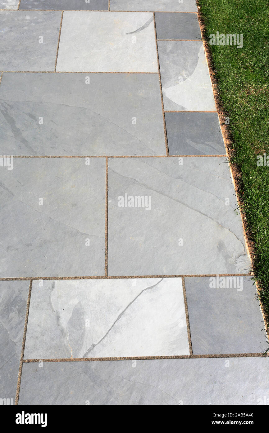 Patio paving slabs in a residential garden environment Stock Photo - Alamy