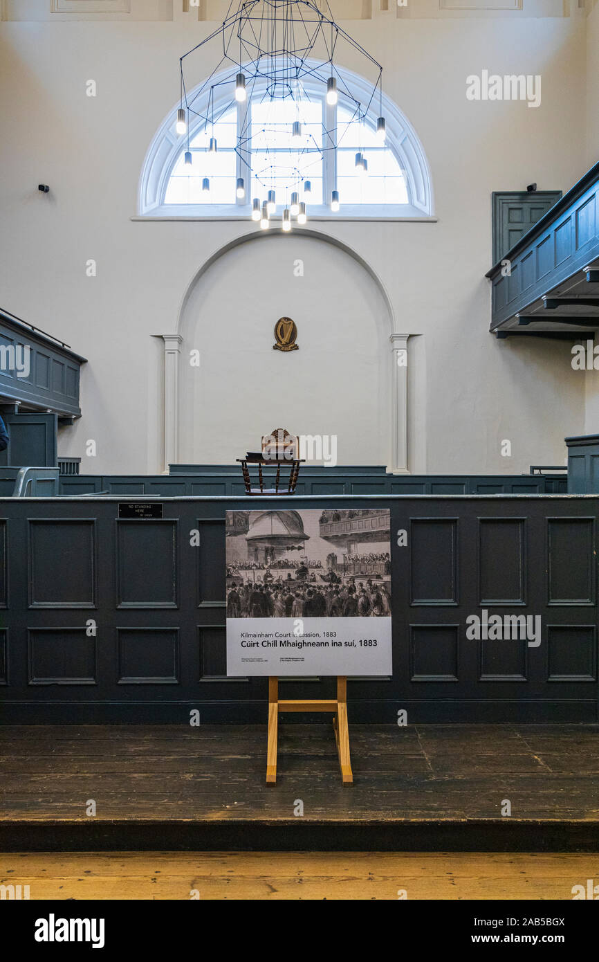 Courtroom in Kilmainham gaol with chair on table for the defendant and ...