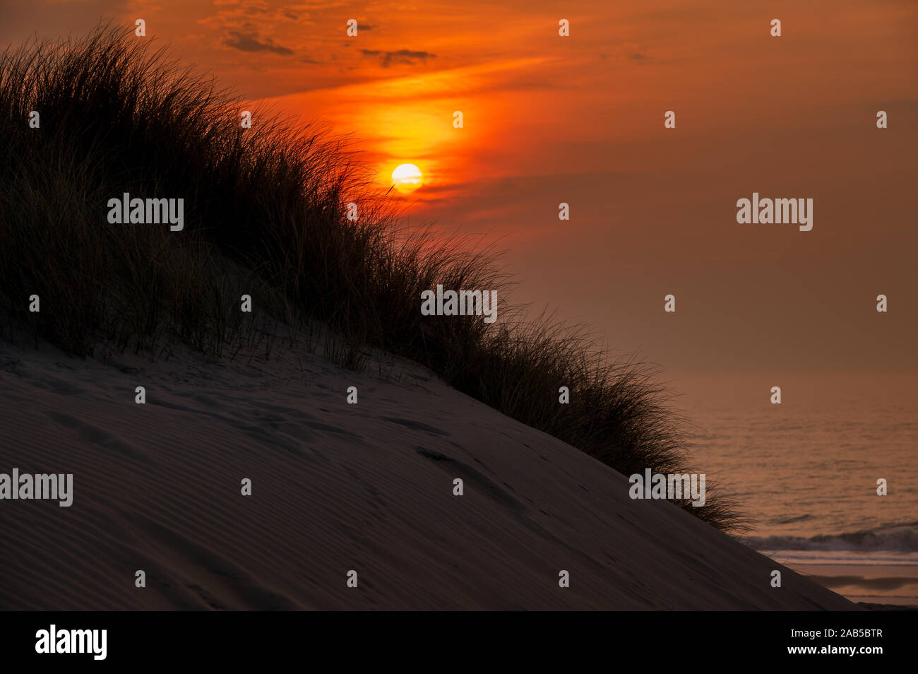 Sunset on the beach in Holland Stock Photo - Alamy