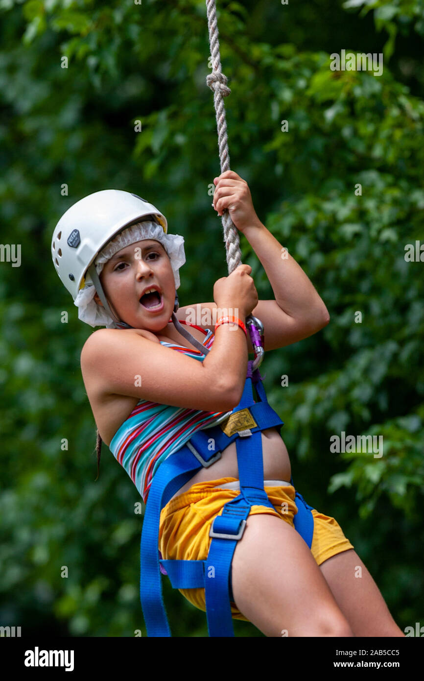 Girl on zip line hi-res stock photography and images - Alamy