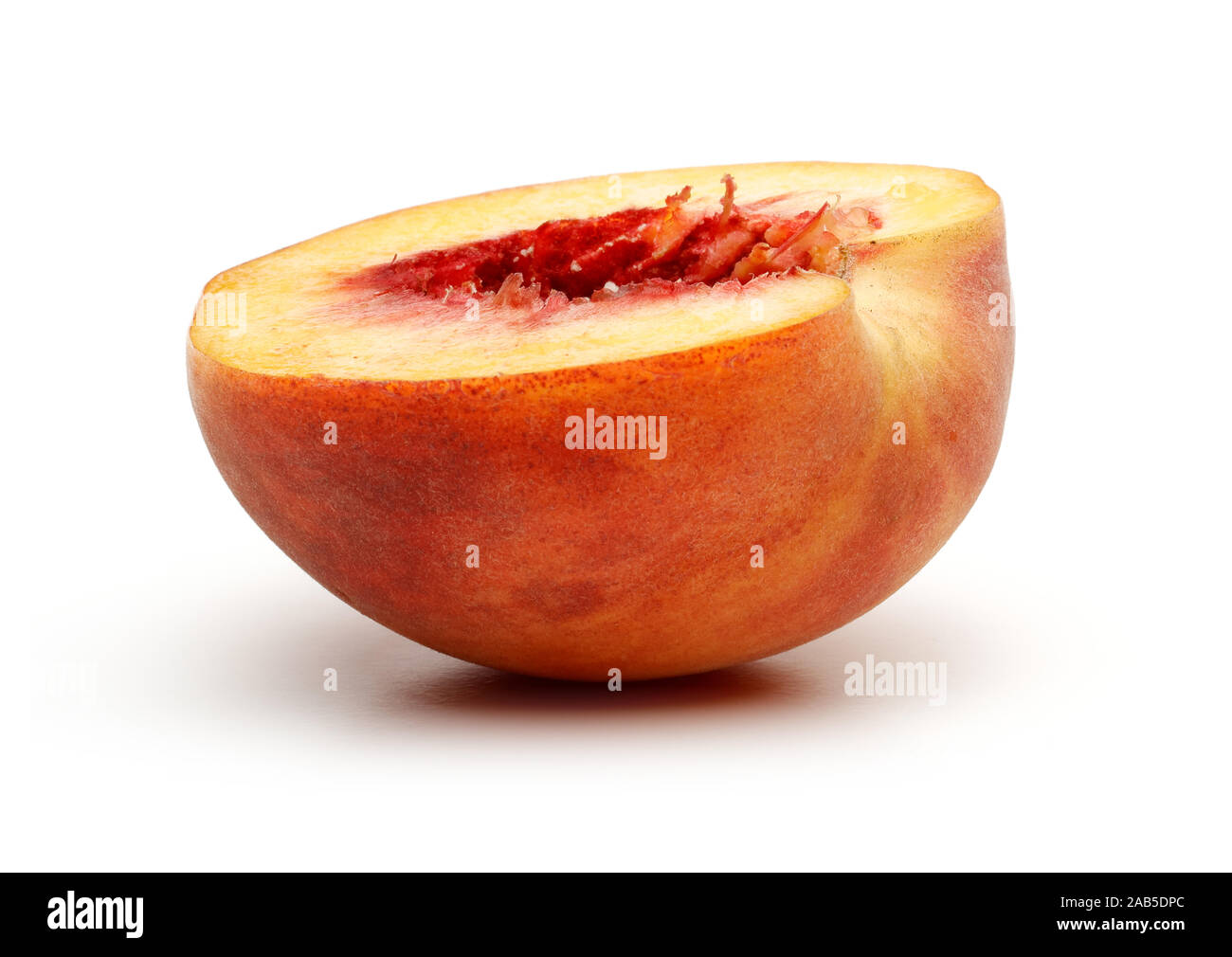 Half of peach fruit isolated on white background Stock Photo - Alamy