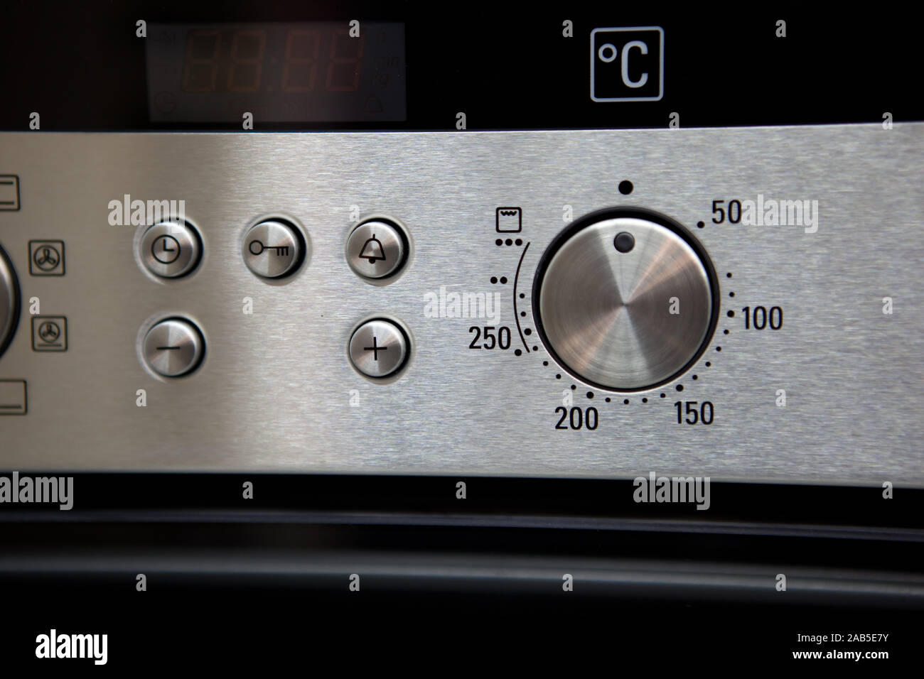 closeup of oven dashboard with grey buttons Stock Photo - Alamy